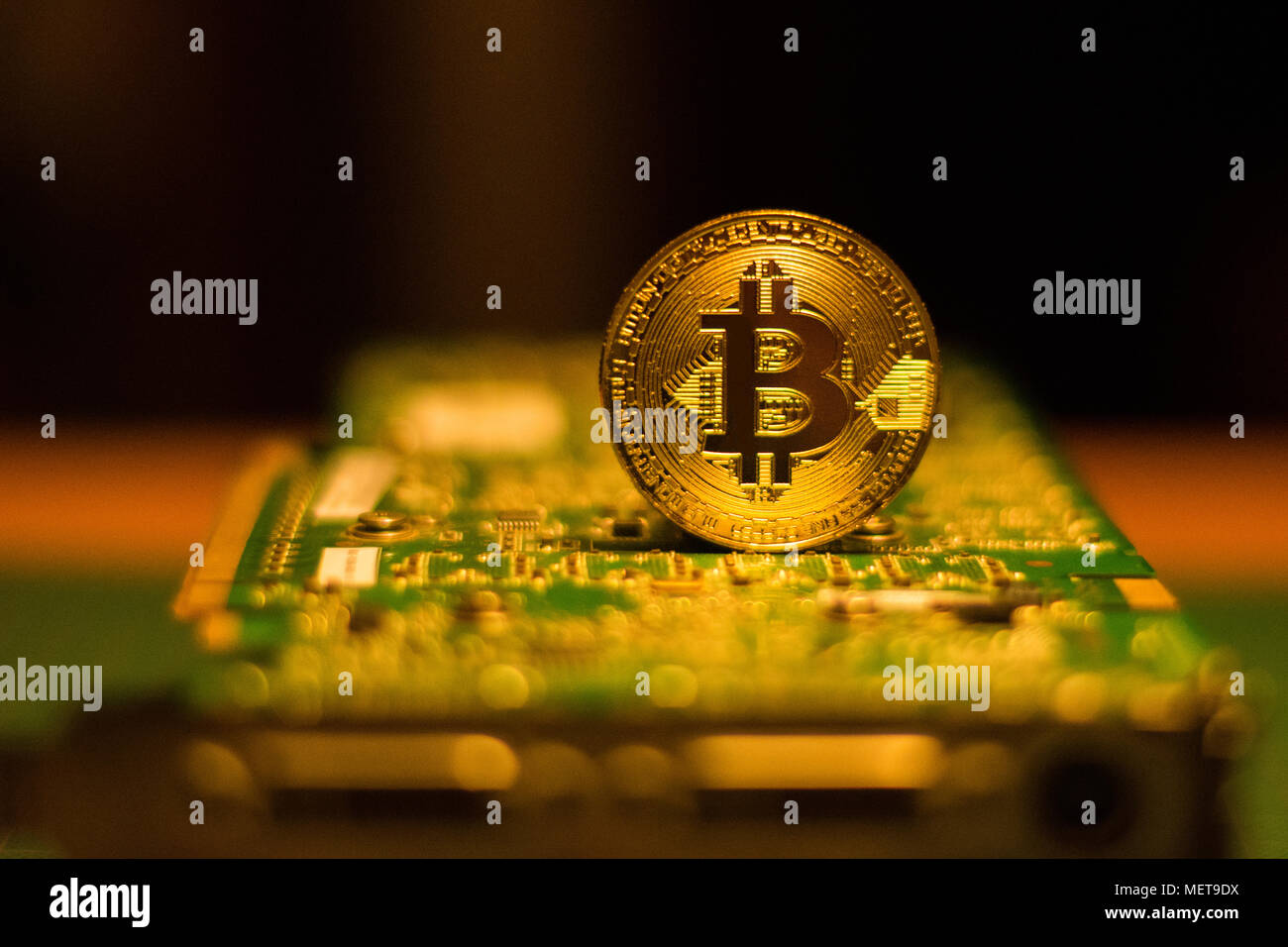 Bitcoin graphic card mining on a blurry dark background Stock Photo - Alamy