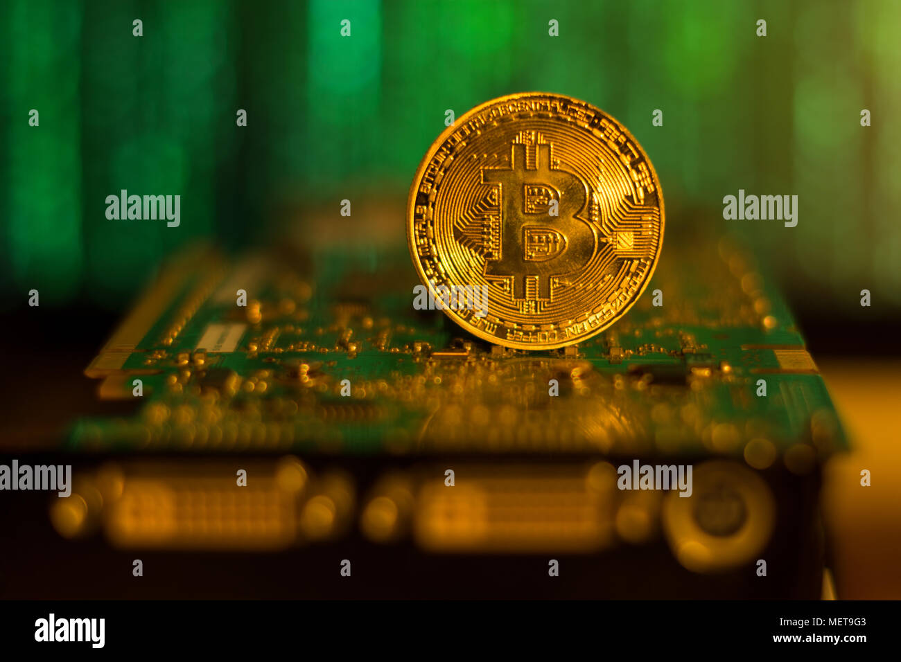 Bitcoin closeup on a mining graphic card with matrix background Stock ...