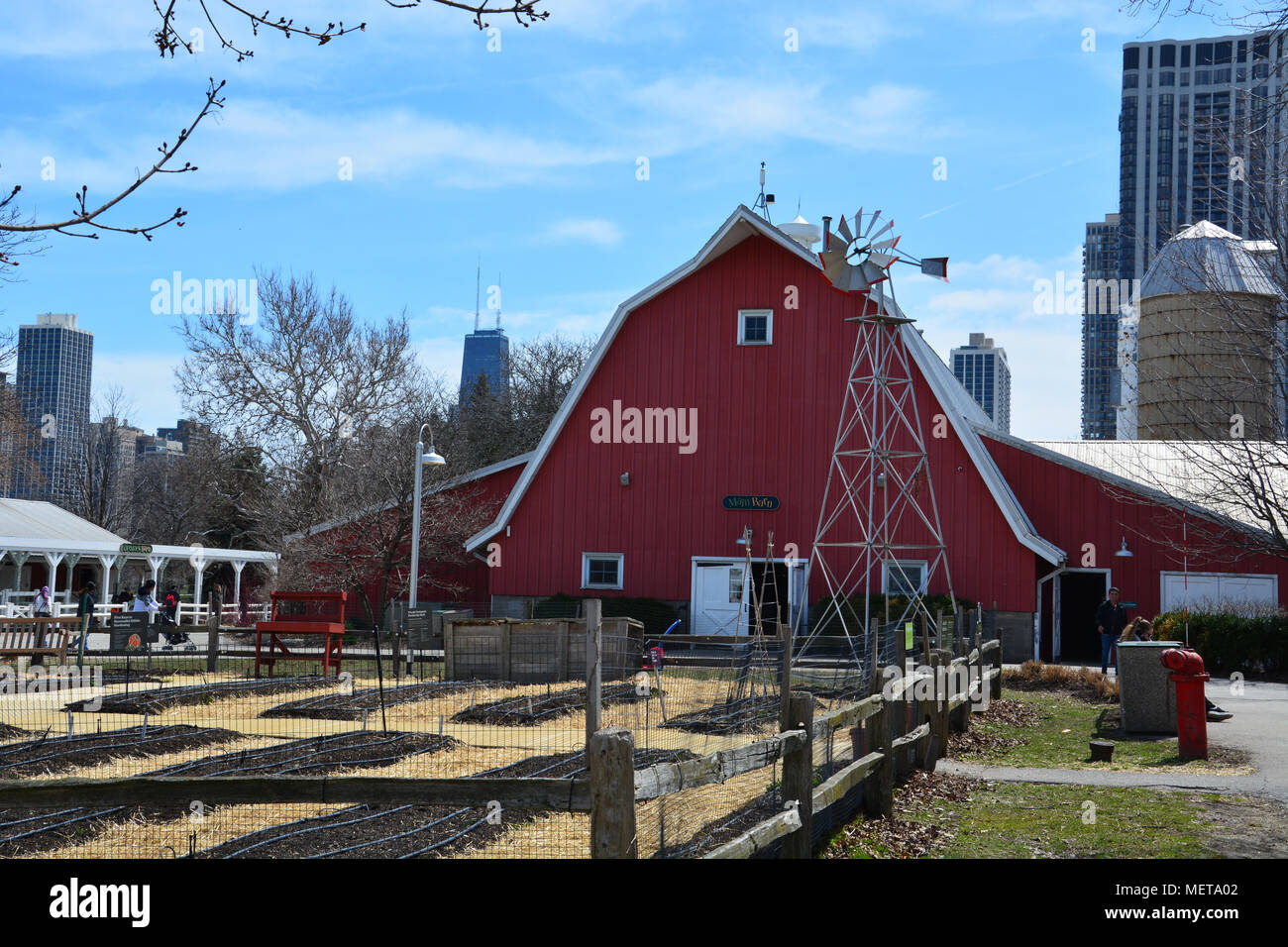 The gardens outside the red Main Barn at the "Farm in the Zoo" at the ...