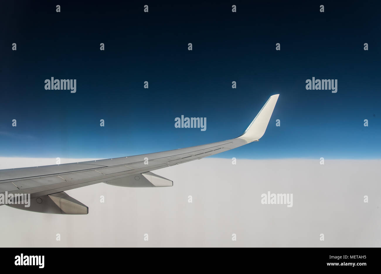 Jetliner Wing Over Clouds Stock Photo - Alamy