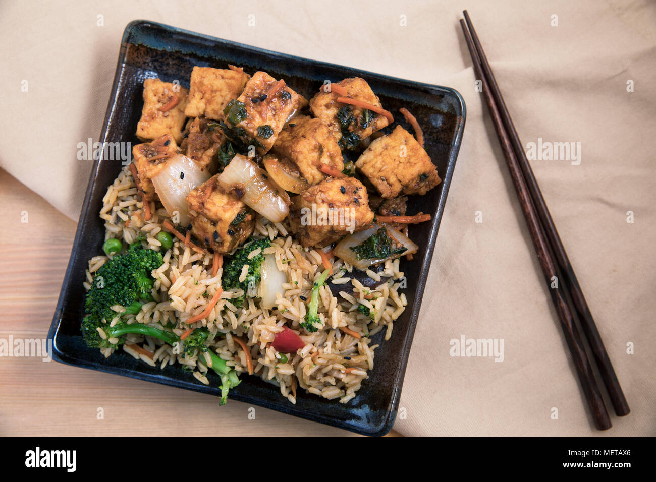 Fried tofu with rice and vegetable stir fry vegan asian meal Stock ...