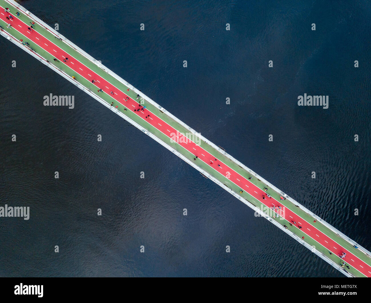 Aerial top view of pedestrian and cycling path lane on Park bridge and ...
