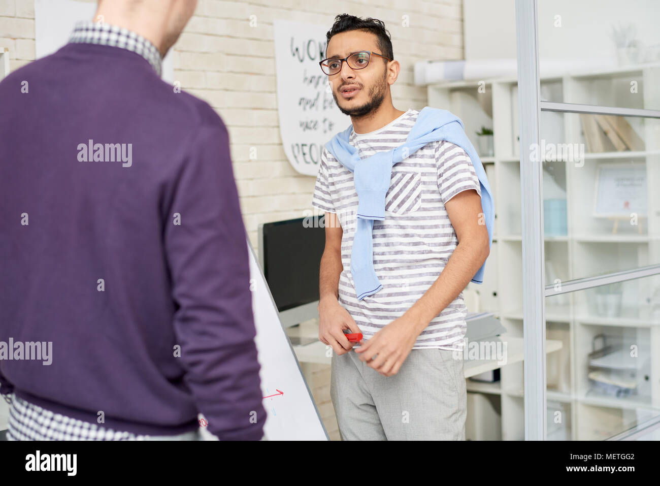 Sharing Creative Ideas with Coworker Stock Photo - Alamy