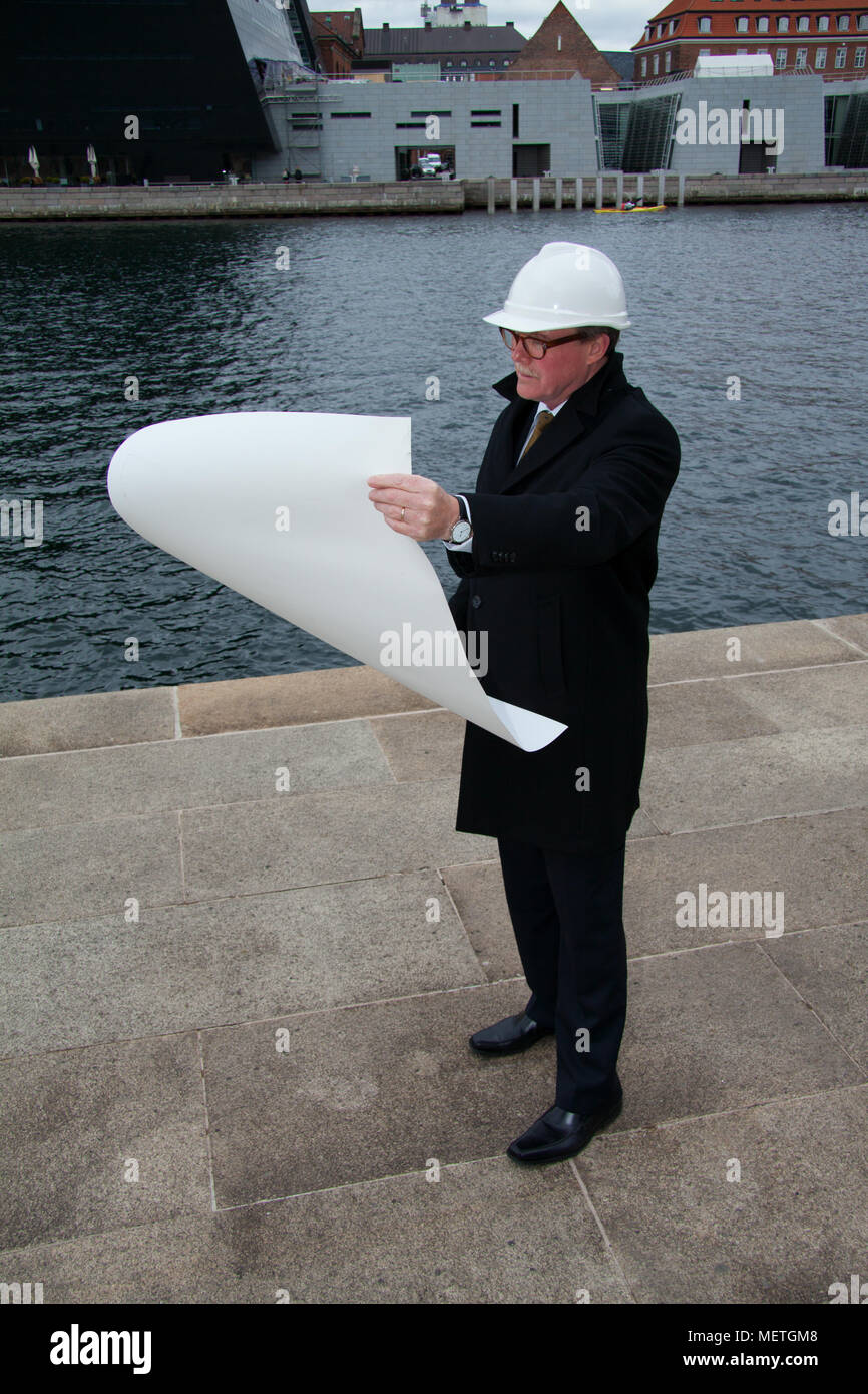 Business construction man engineer architect with blueprint on the work ...