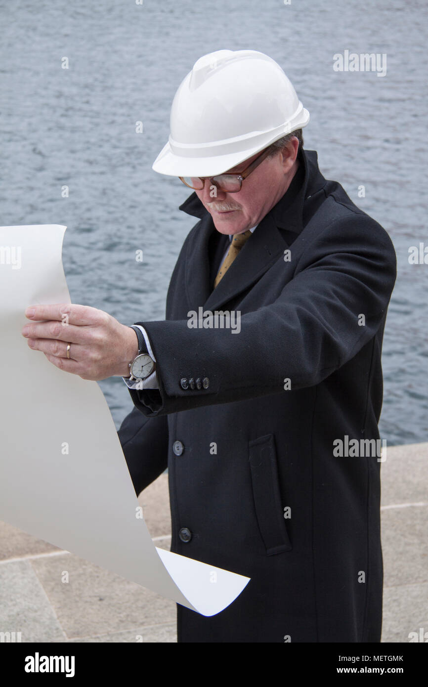 Business construction man engineer architect with blueprint on the work ...