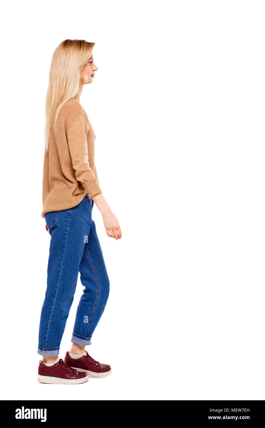 side view of walking woman. beautiful girl in motion. backside view of ...