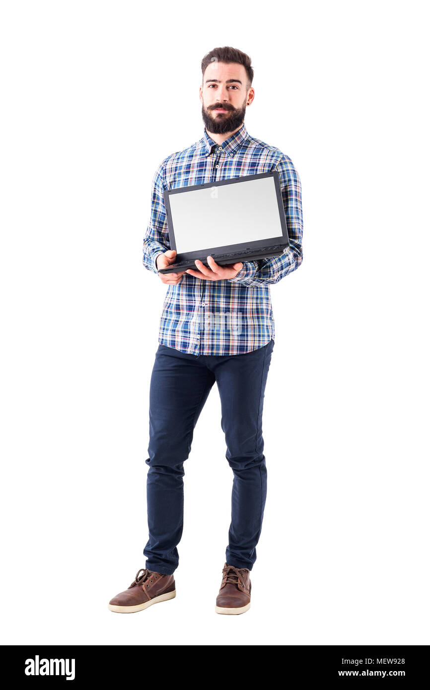 Confident young bearded programmer showing blank empty laptop monitor ...