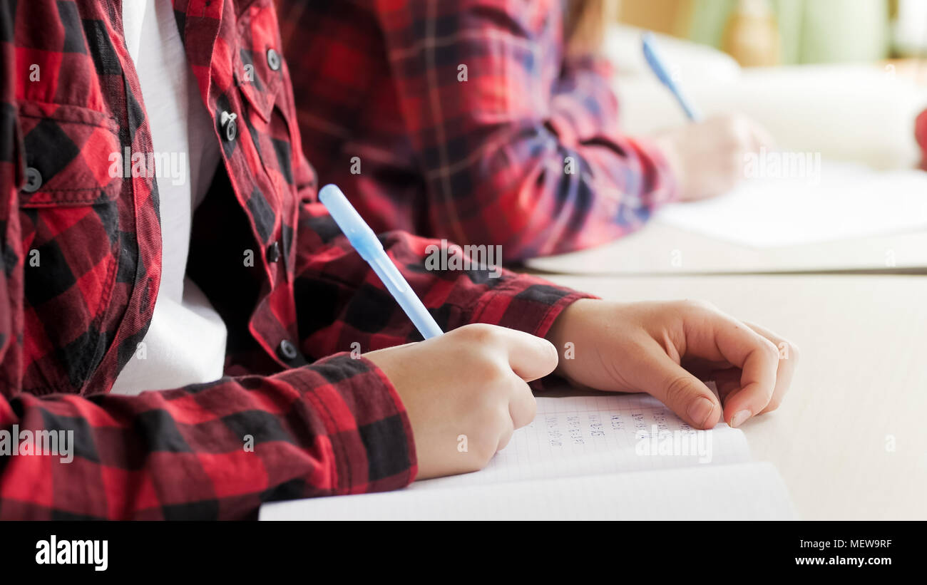 Girls hand holding pen writing hi-res stock photography and images - Alamy