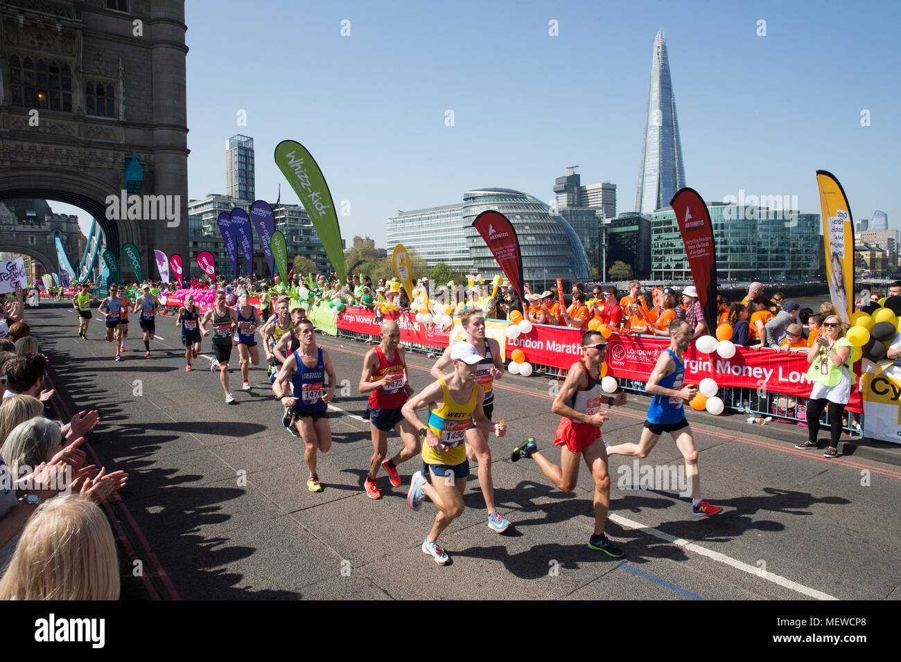 Competitors in the 38th London Marathon, some in fancy dress, cross ...