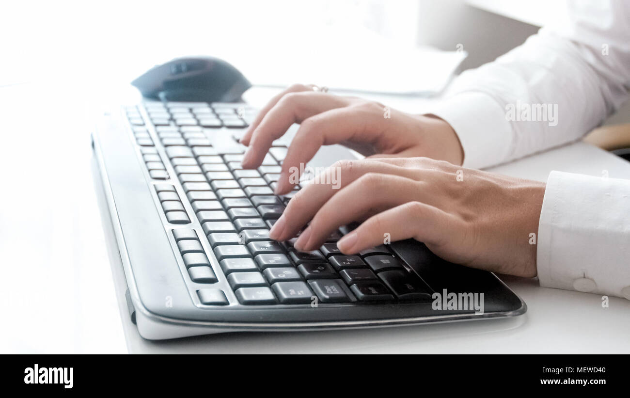 Closeup image of female hands typing text on keyboard Stock Photo - Alamy