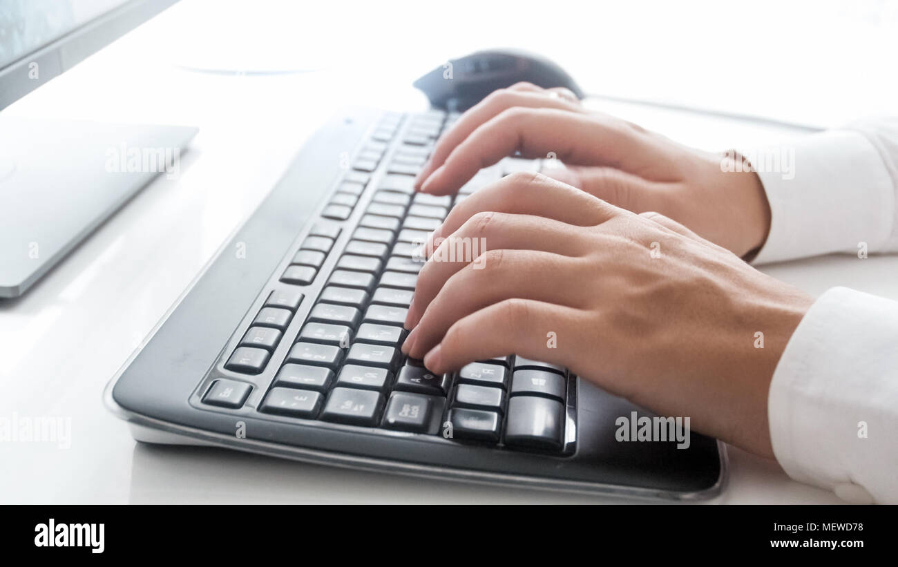 Closeup shot of female secretary typing text on computer keyboard Stock ...