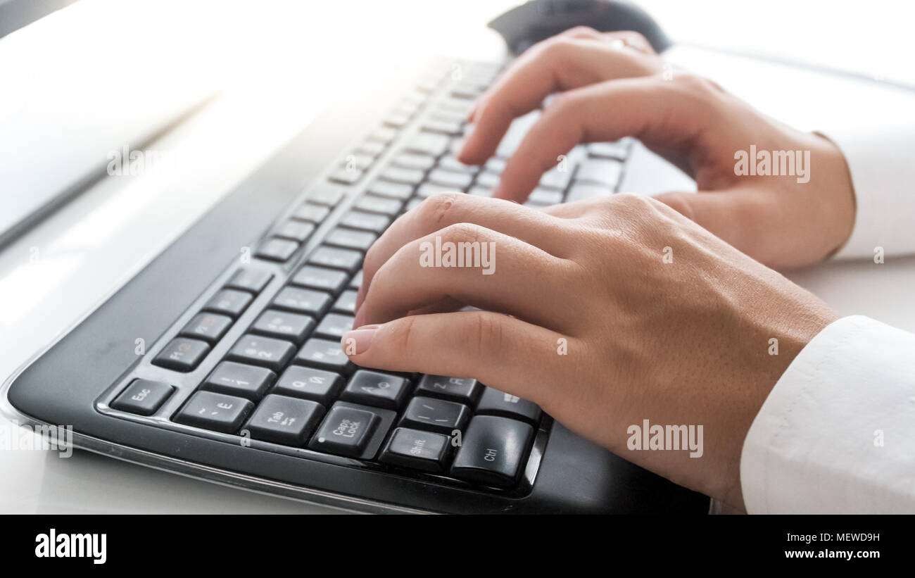 Macro photo of beautiful female hands pressing buttons on keyboard ...