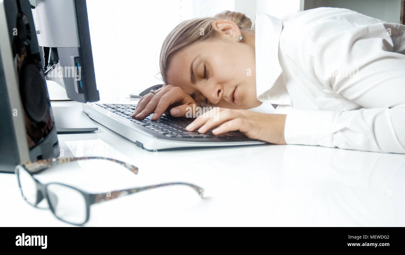 Closeup portrait of tired businesswoman fell asleep on computer ...