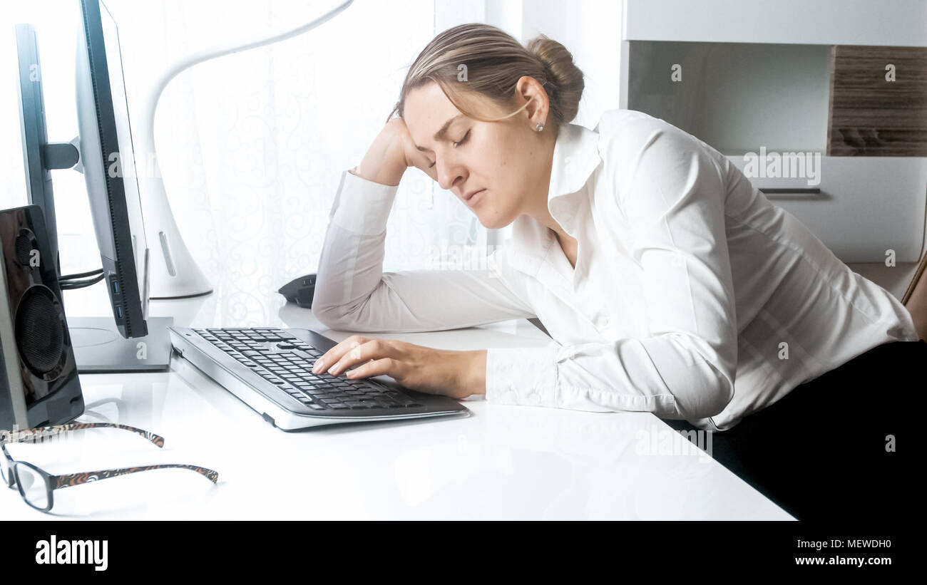 Portrait of tired sleepy female worker at office Stock Photo - Alamy