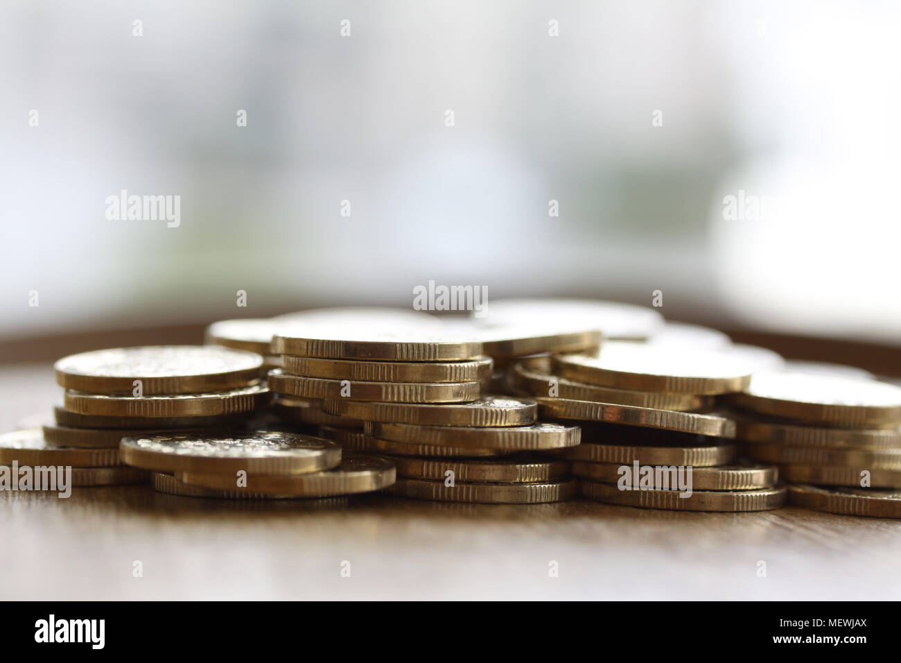 Pile of gold money coins on white background for copy text writing ...