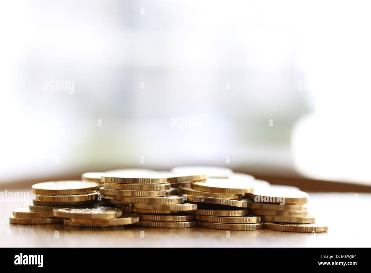 Pile of gold money coins on white background for copy text writing ...