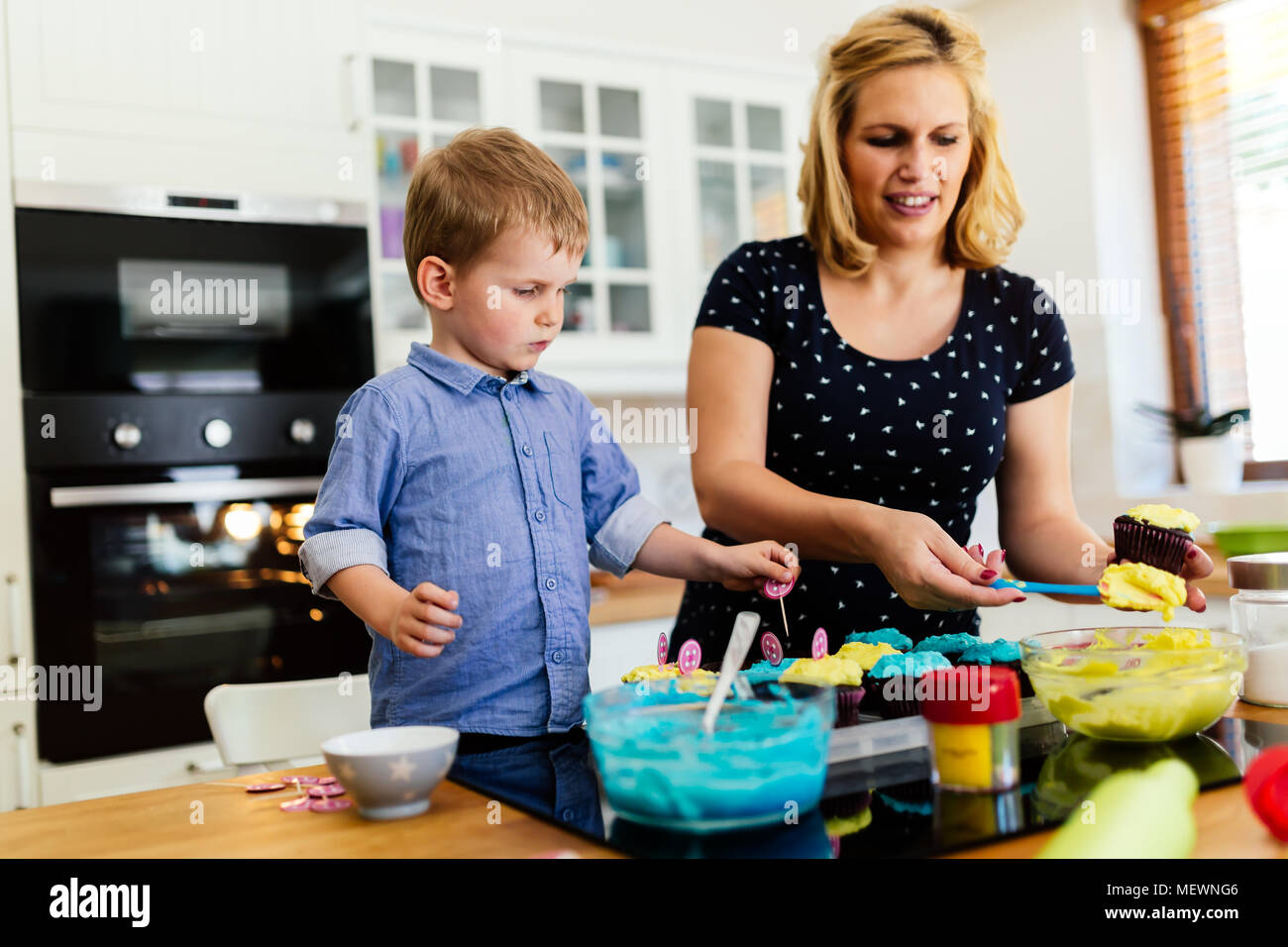 Child helping mother bake cookies Stock Photo - Alamy