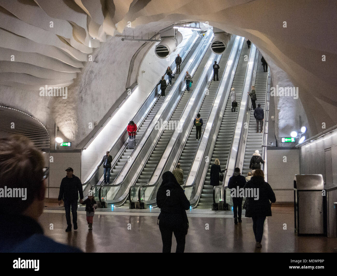 Multiple escalators going up from Stockholms new commuter train station ...