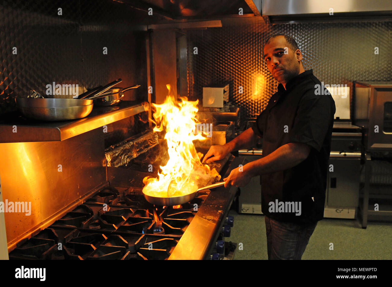 Cooking on stove hi-res stock photography and images - Alamy