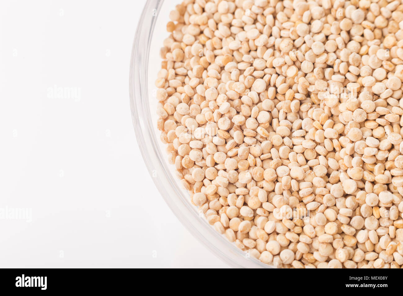Quinoa grains in bowl isolated on white background, Chenopodium quinoa ...