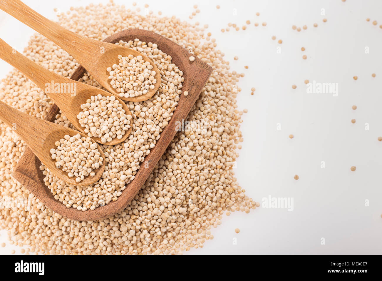 Quinoa grains in bowl isolated on white background, Chenopodium quinoa ...
