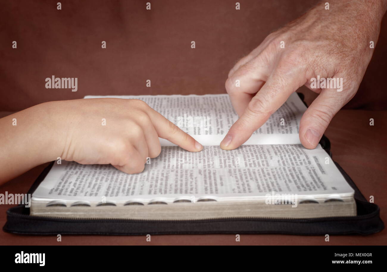 Child reading bible hi-res stock photography and images - Alamy