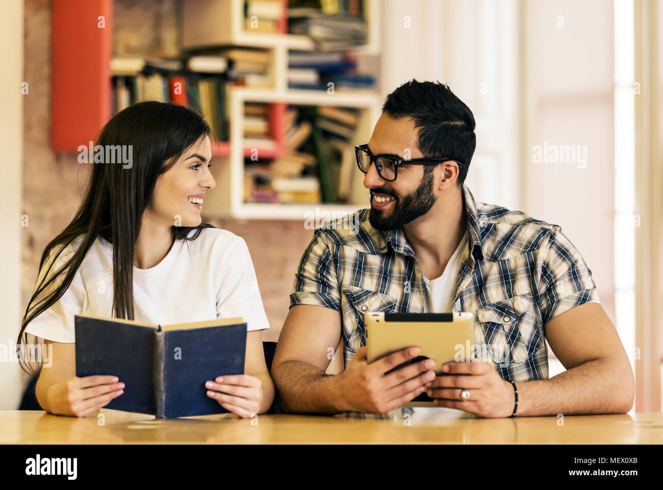 Boy girl reading book couple school hi-res stock photography and images ...