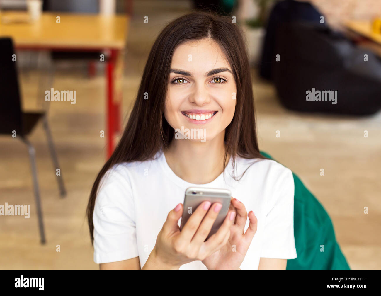 Smiling Girl Texting Message Stock Photo - Alamy