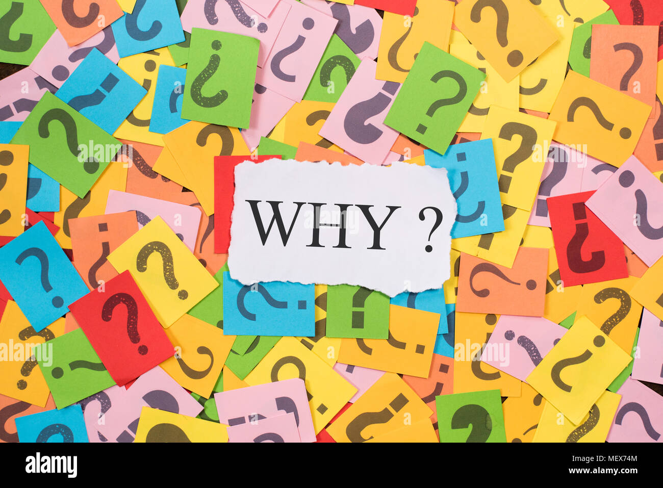 colourful paper note with question mark and white paper with word WHY ...