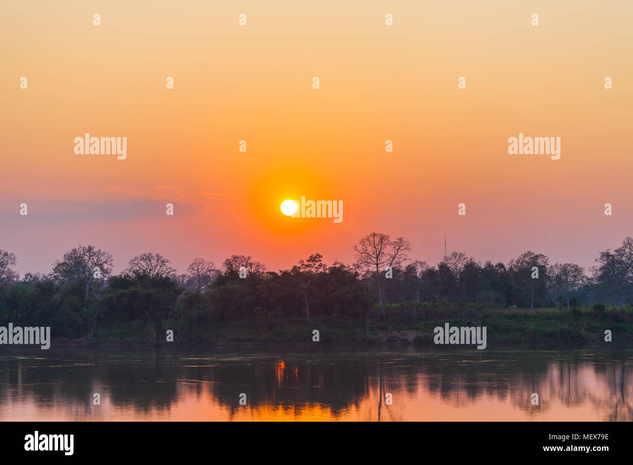 beautiful sunset above Kong river in Laos Stock Photo - Alamy
