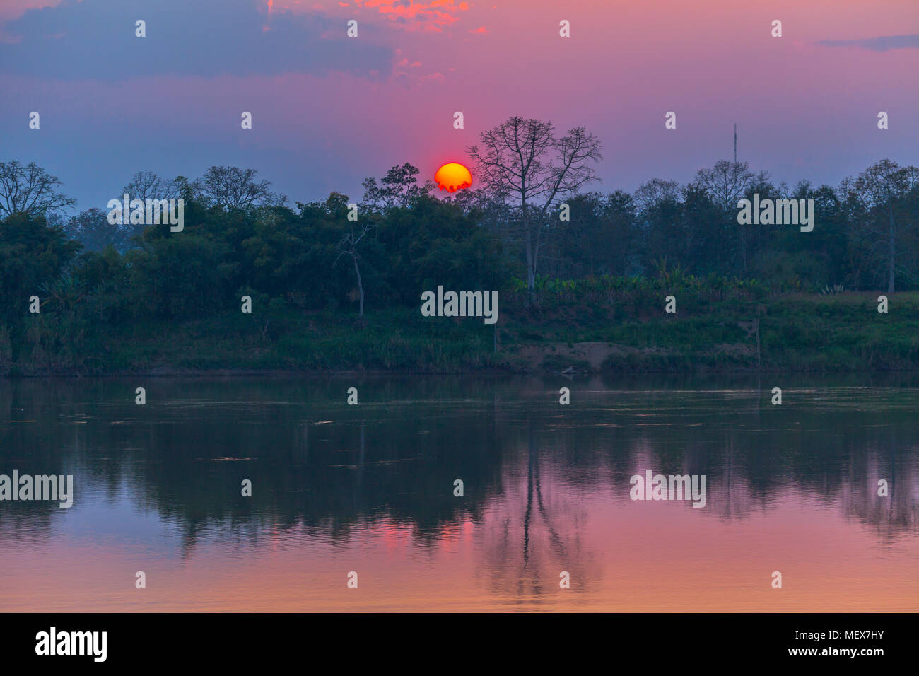 beautiful sunset above Kong river in Laos Stock Photo - Alamy