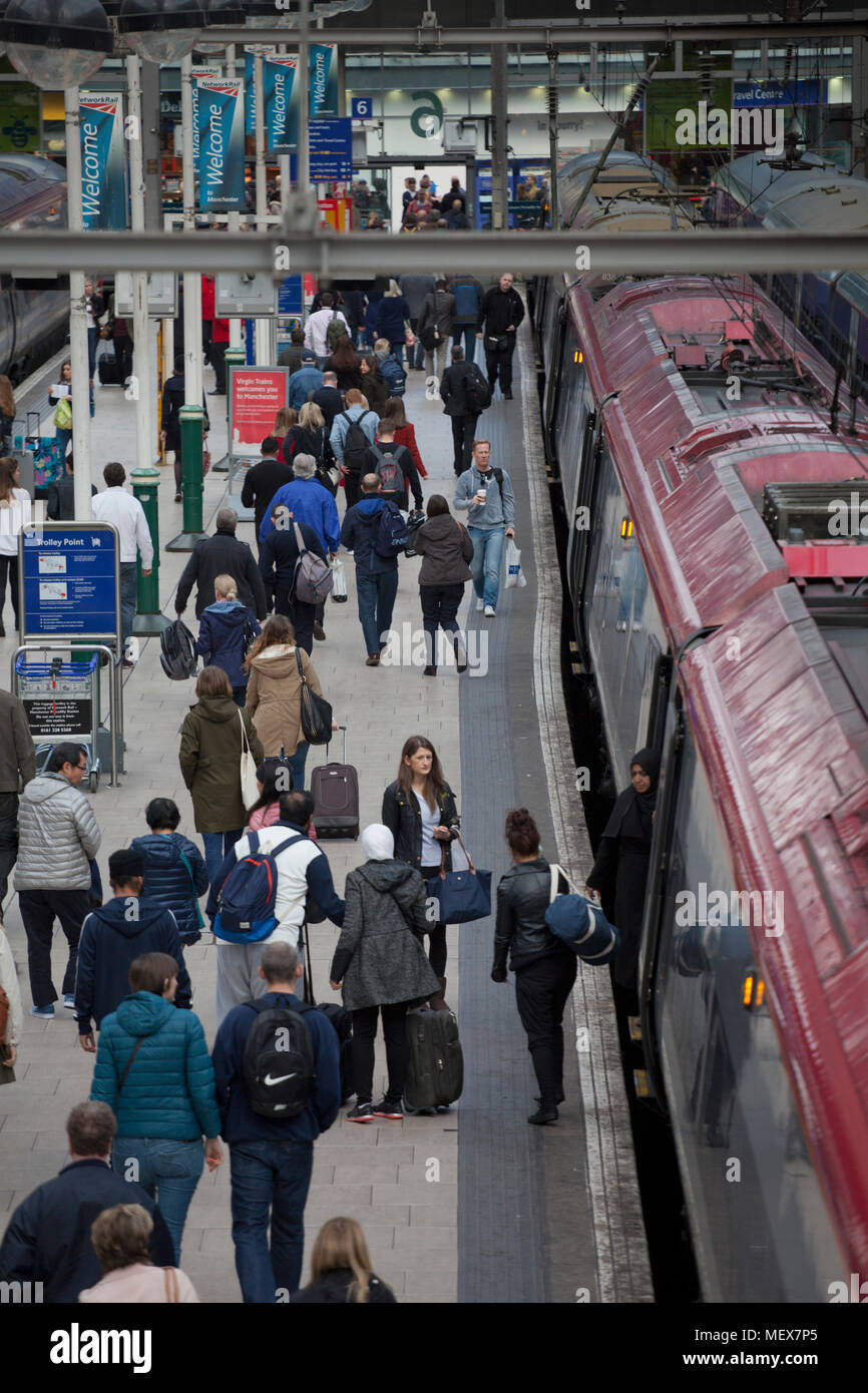 Passengers leaving a Virgin Trains pendolino train at Manchester ...