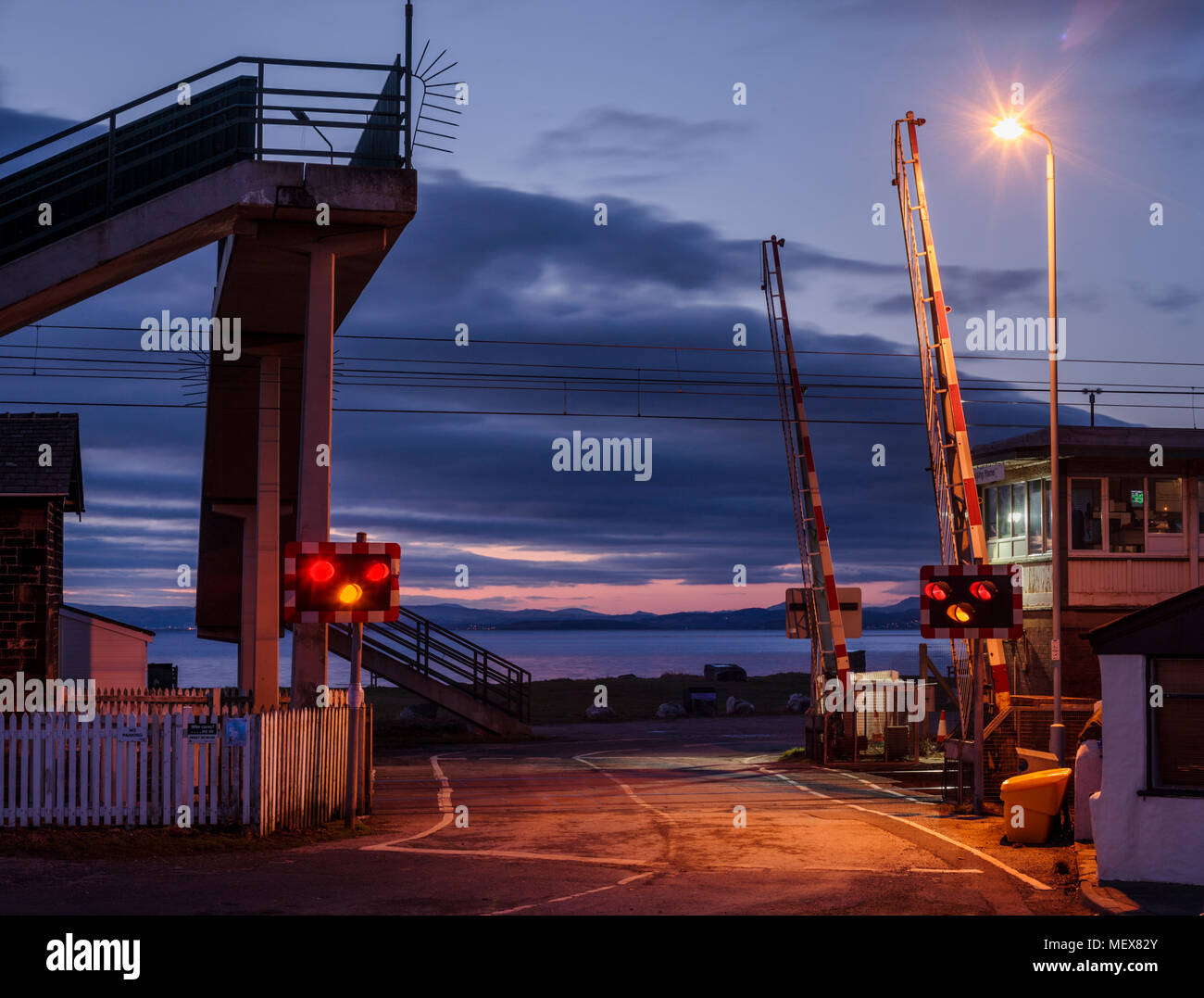Hest Bank Level crossing with barriers and flashing lights on the west ...