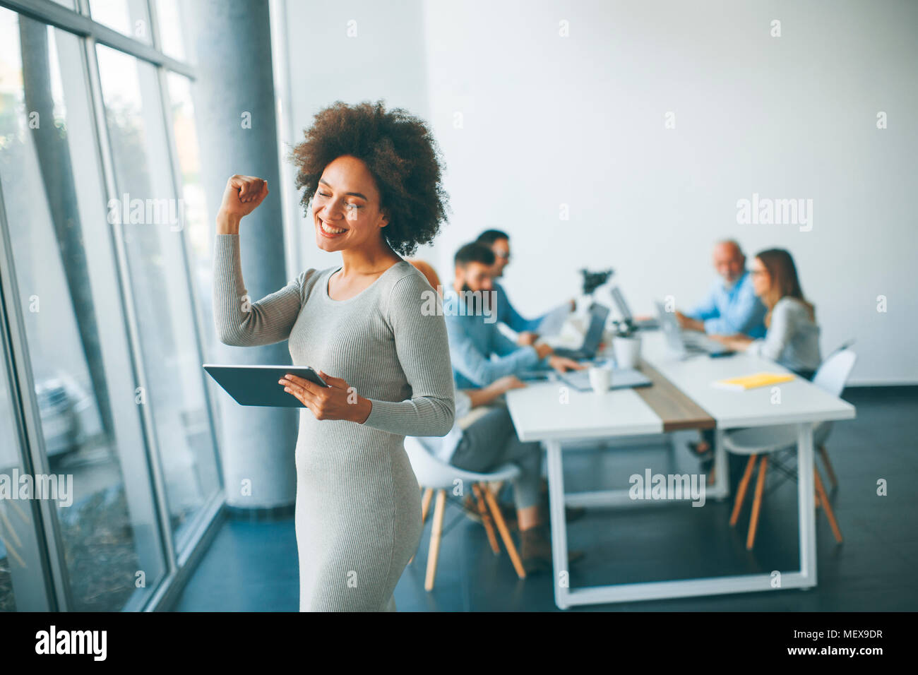 Typical business day at a modern company with multiethnic group of ...