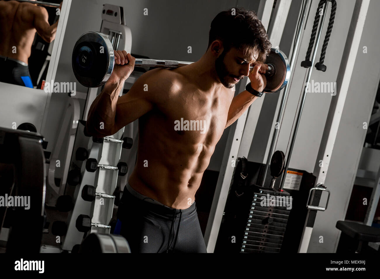 Man flexing muscles hi-res stock photography and images - Alamy