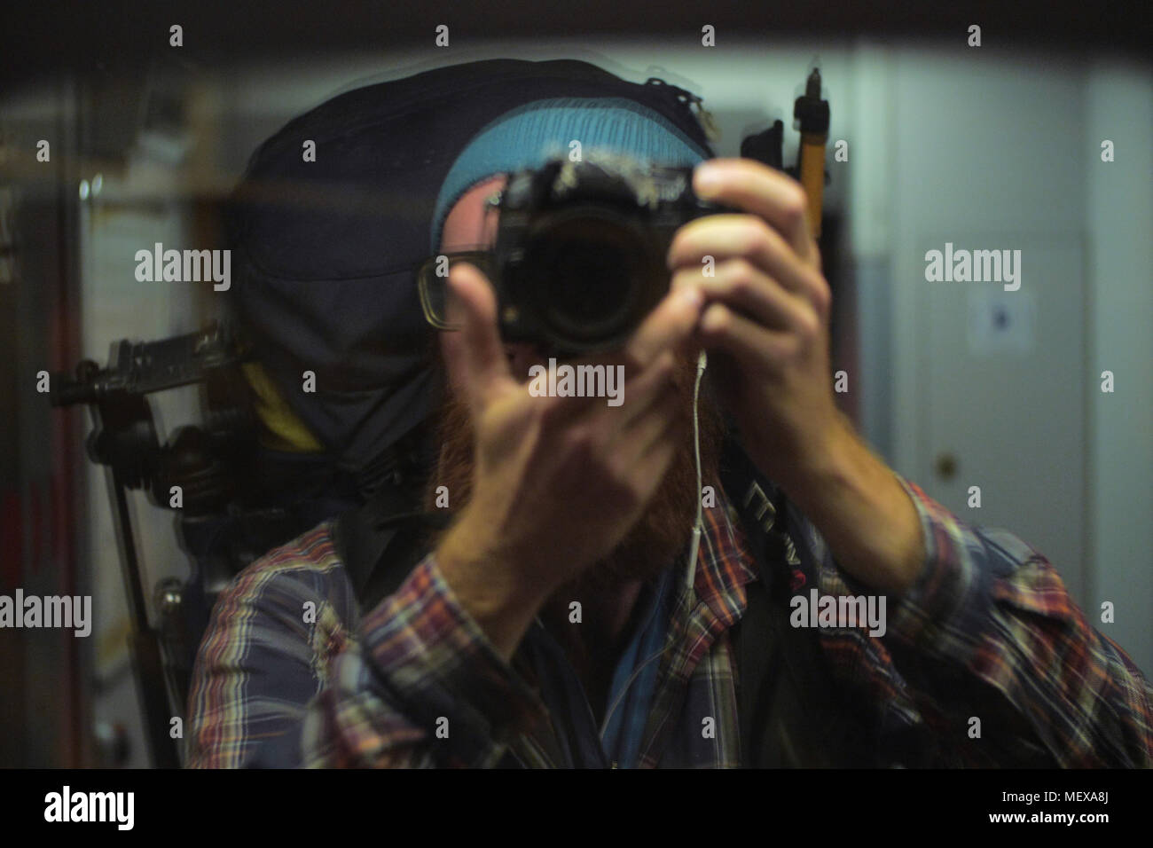 photographer taking a selfie in a window reflection Stock Photo - Alamy