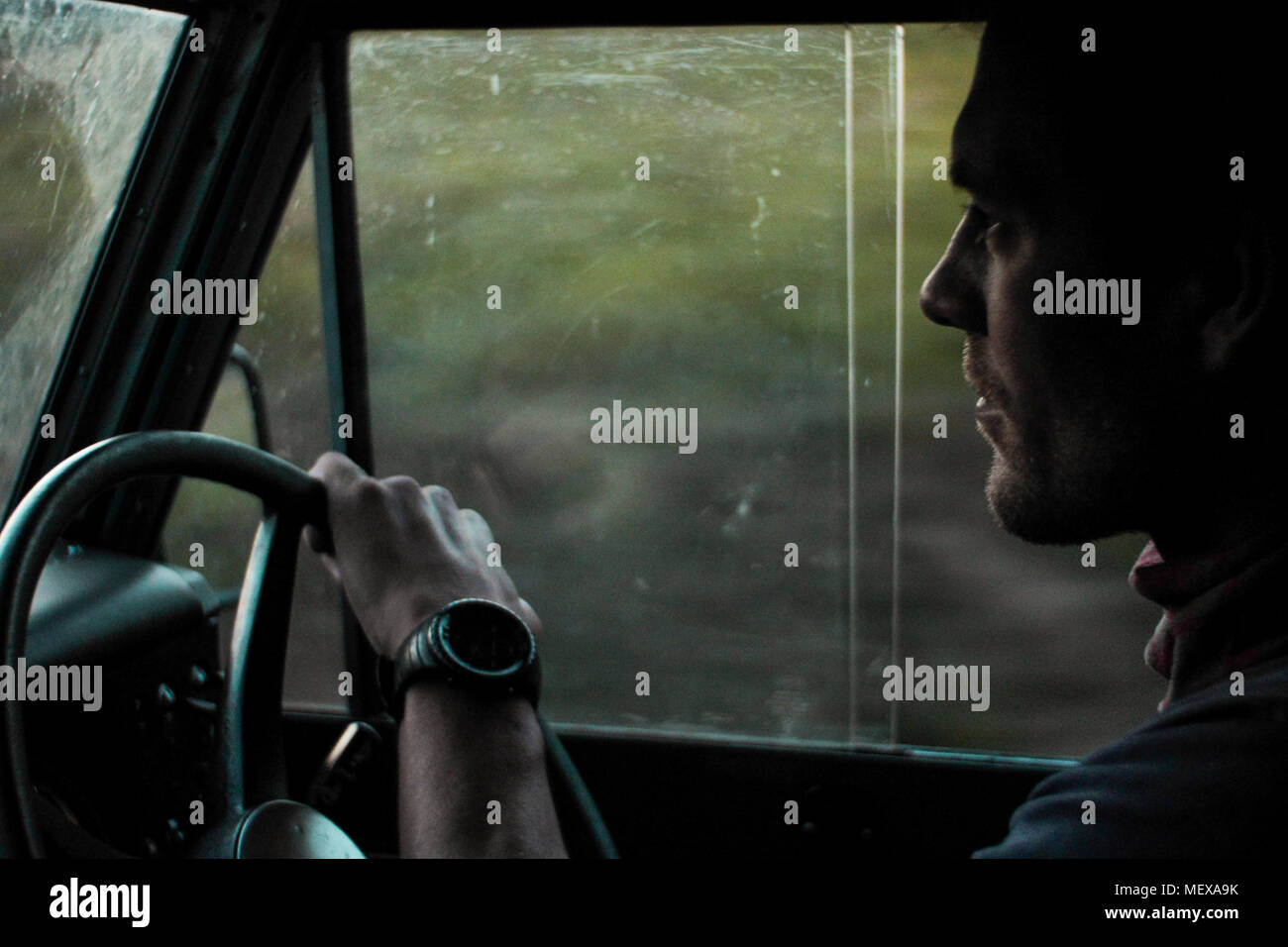 caucasian man driving a off road jeep Stock Photo - Alamy