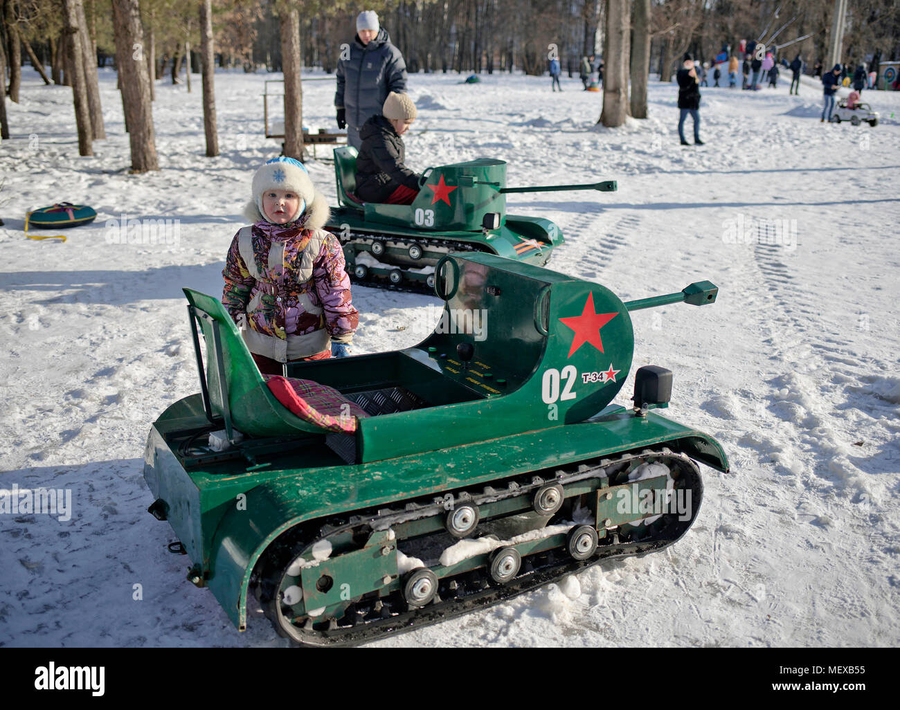 girl, child, tank, toy, electric power,park, Russia Stock Photo - Alamy