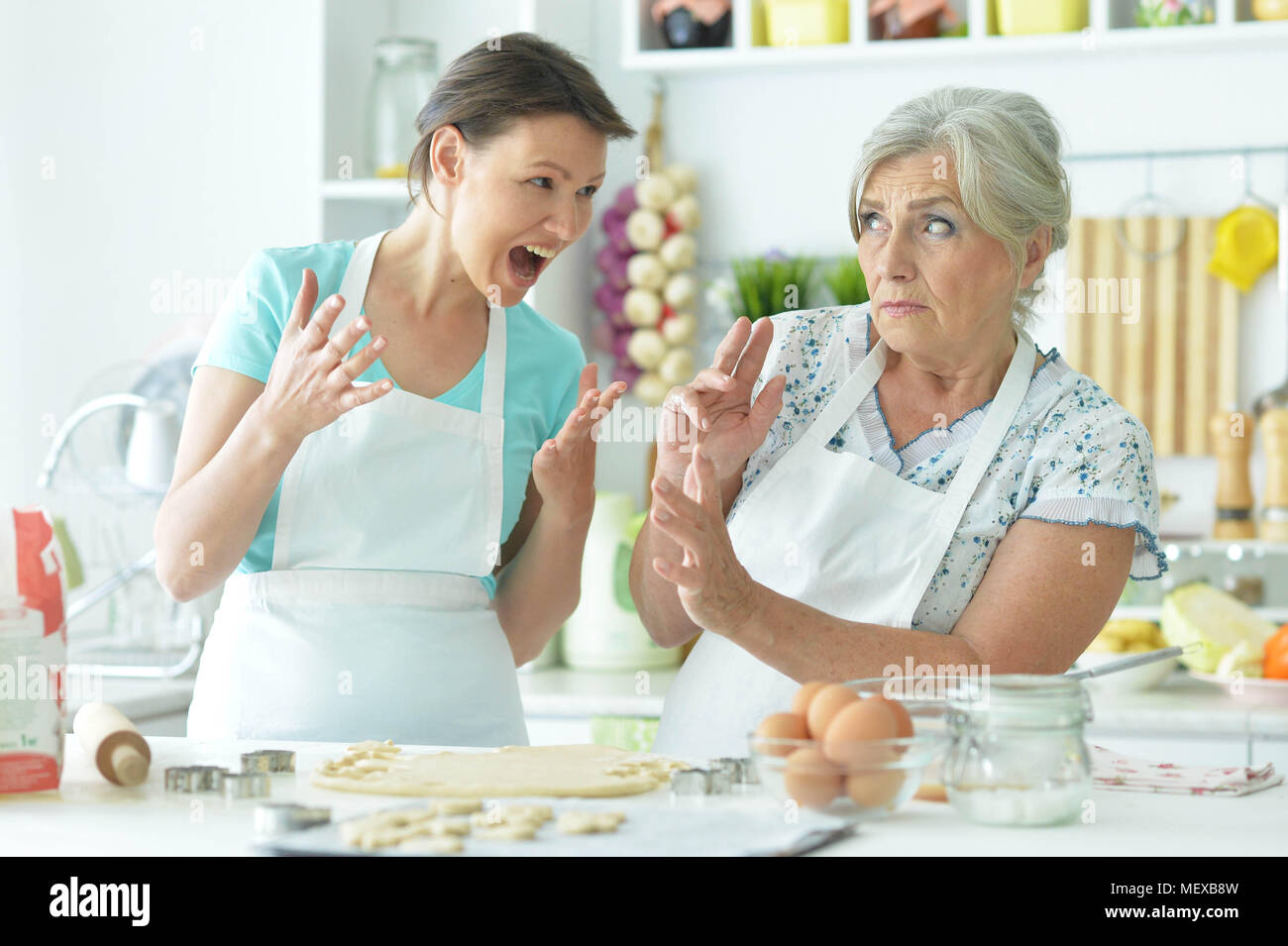 Caucasian family parents daughter cooking hi-res stock photography and ...