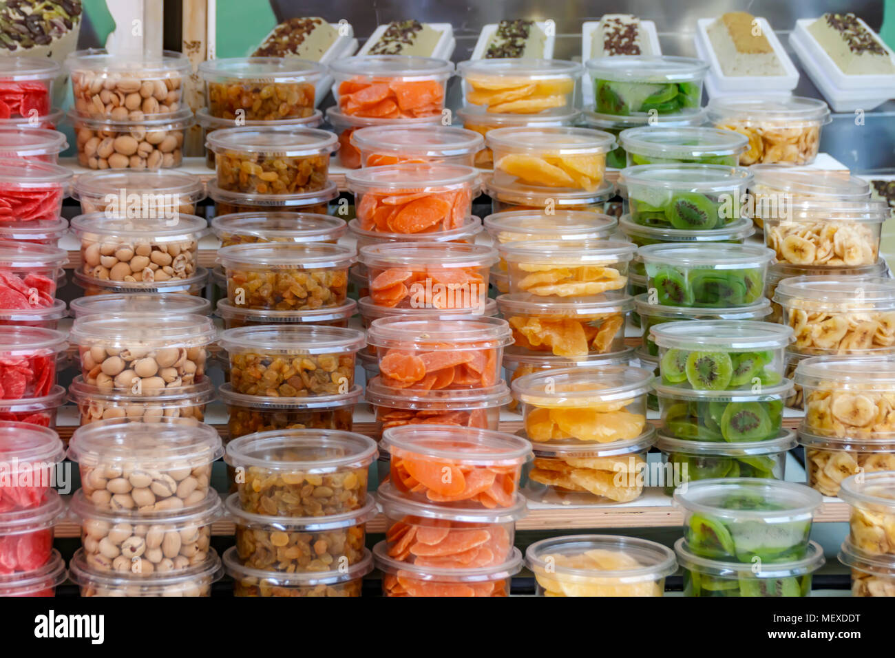 Oriental sweets, dried fruits in plastic jars Stock Photo - Alamy