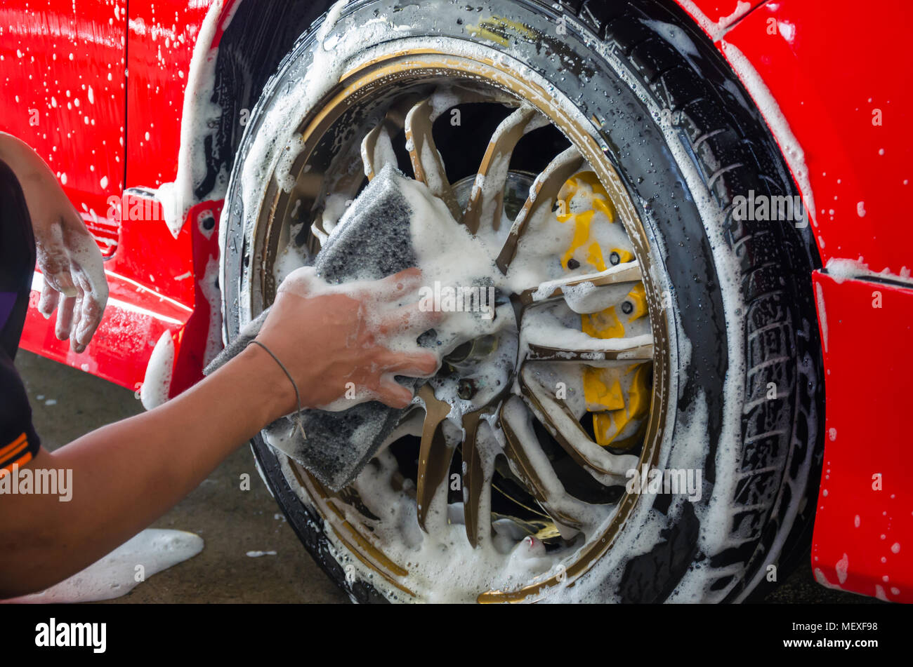 male hand washing wheel car Stock Photo - Alamy