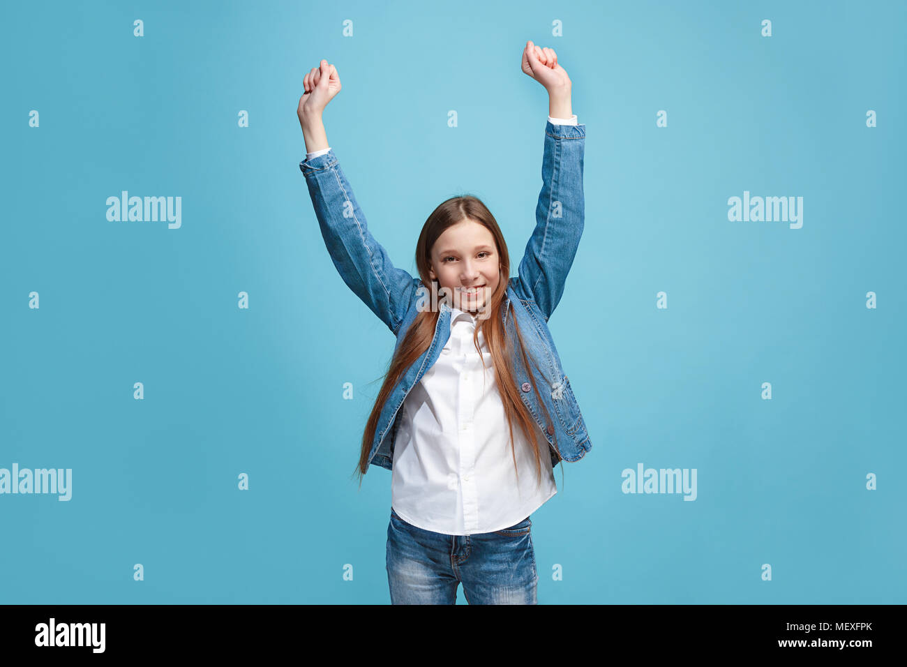 Happy success teen girl celebrating being a winner. Dynamic energetic ...