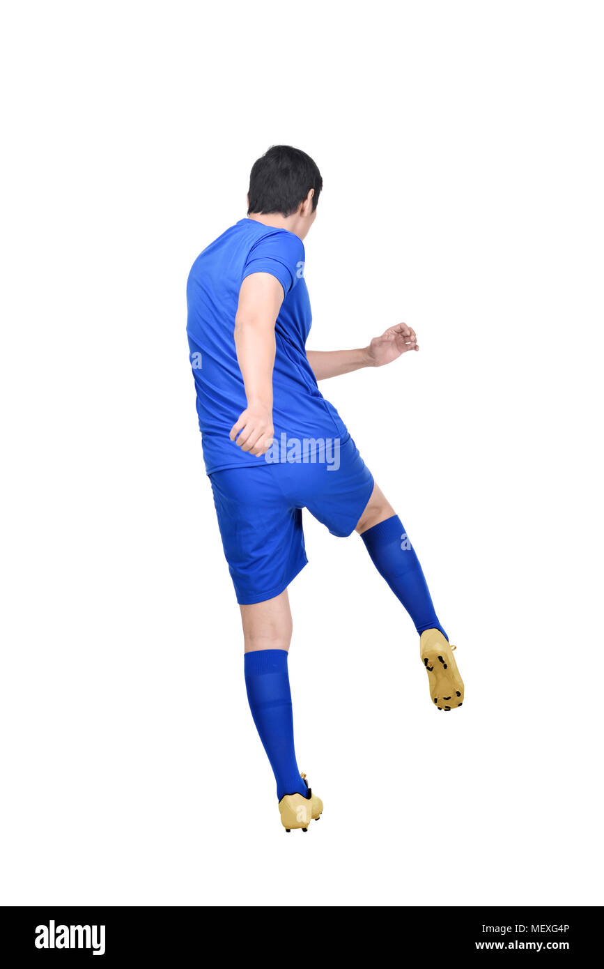 Rear view of asian footballer man shooting the ball posing isolated ...