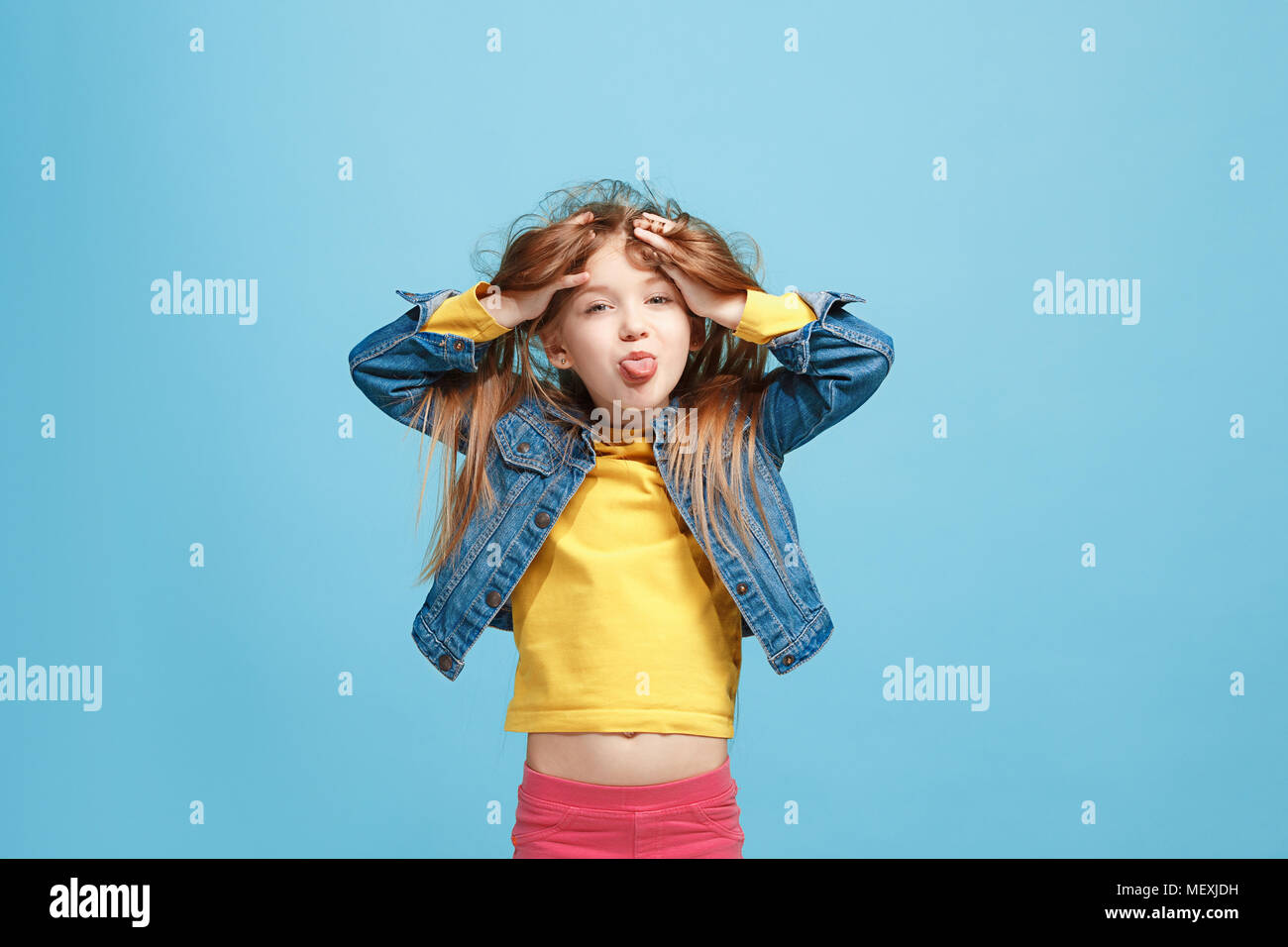 The squint eyed teen girl with weird expression Stock Photo - Alamy