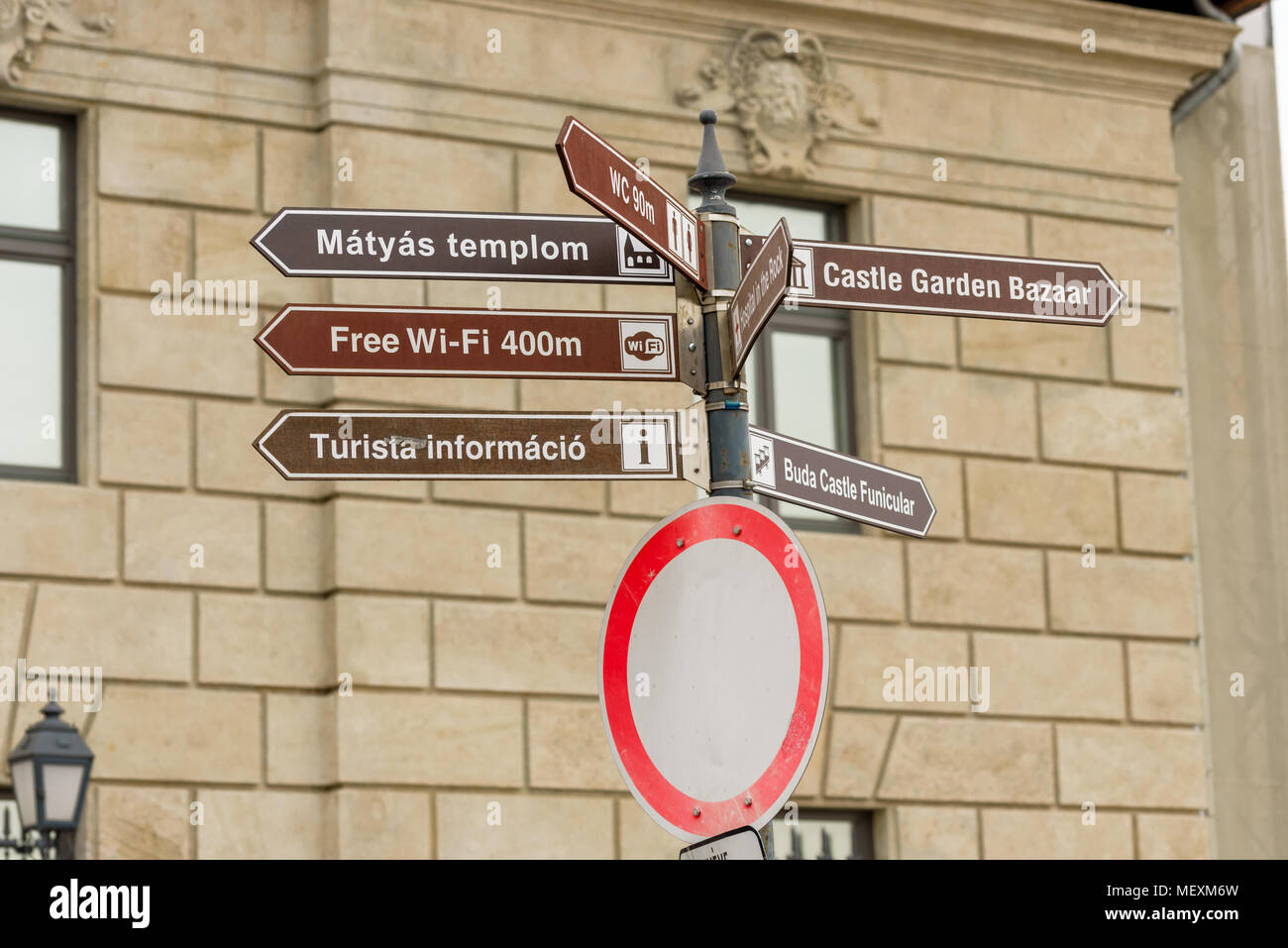 signboard with signs in the old town for tourists Budapest, Hungary ...