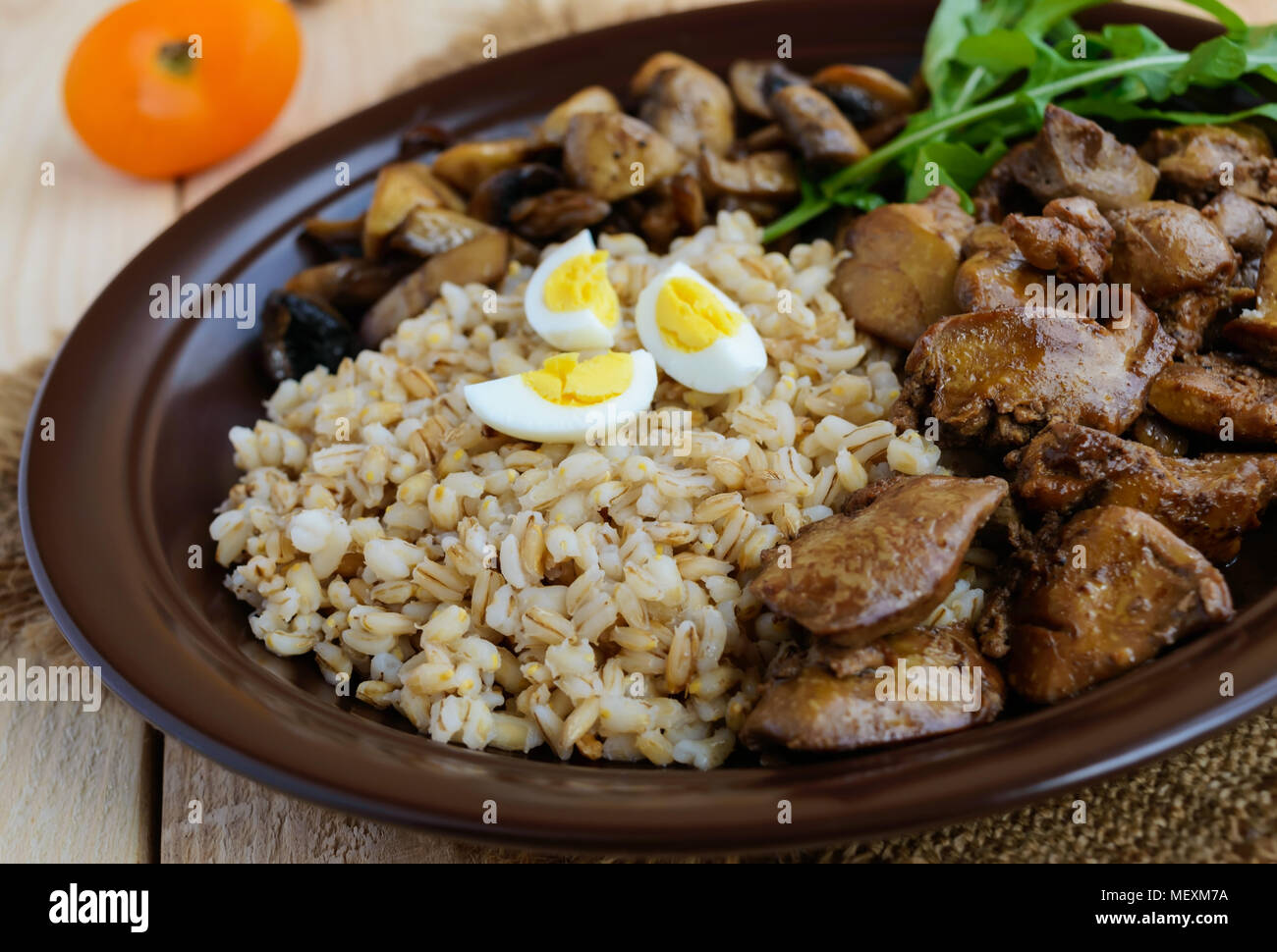 Barley porridge, fried mushrooms and duck liver, boiled quail eggs ...