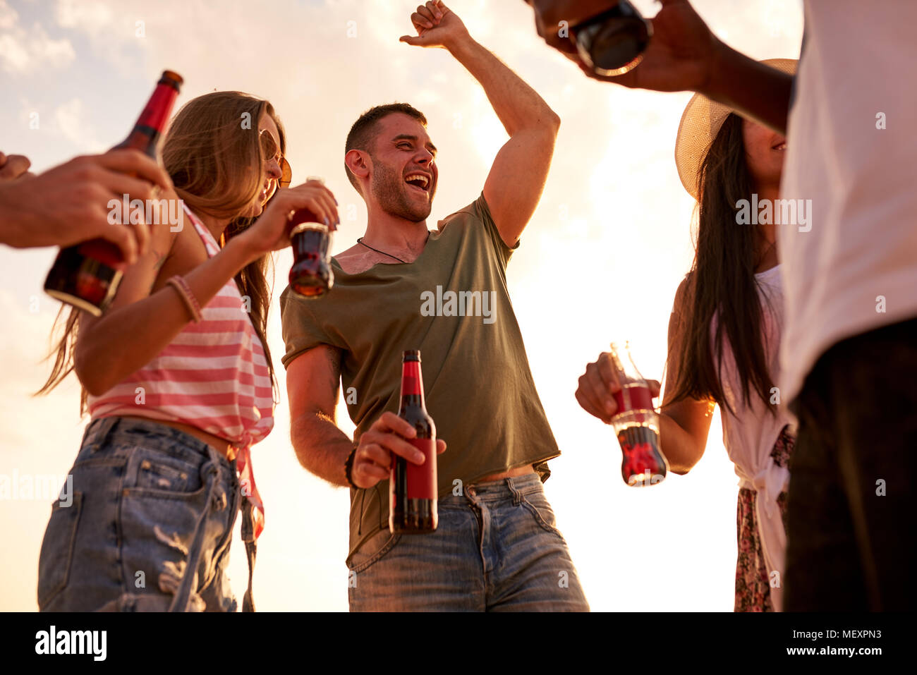 Joyful friends enjoying open-air party Stock Photo - Alamy