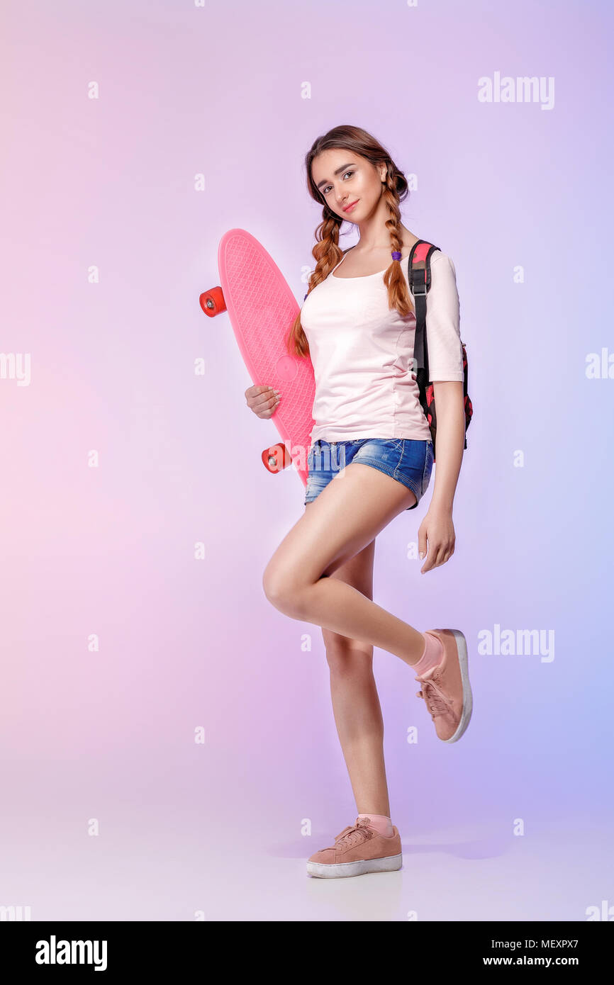 beautiful woman with skate in studio Stock Photo - Alamy