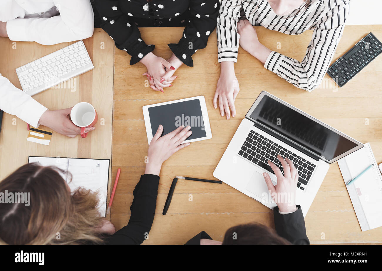 Young business team working together as a group on office desk with ...