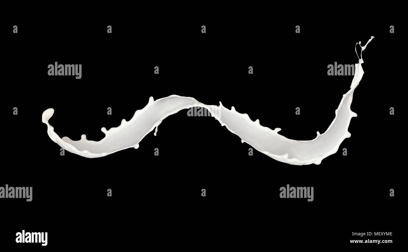 Abstract splash of milk isolated on black background. High resolution ...